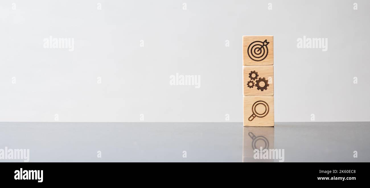 wood block with business goal, strategy, target, mission, action ...