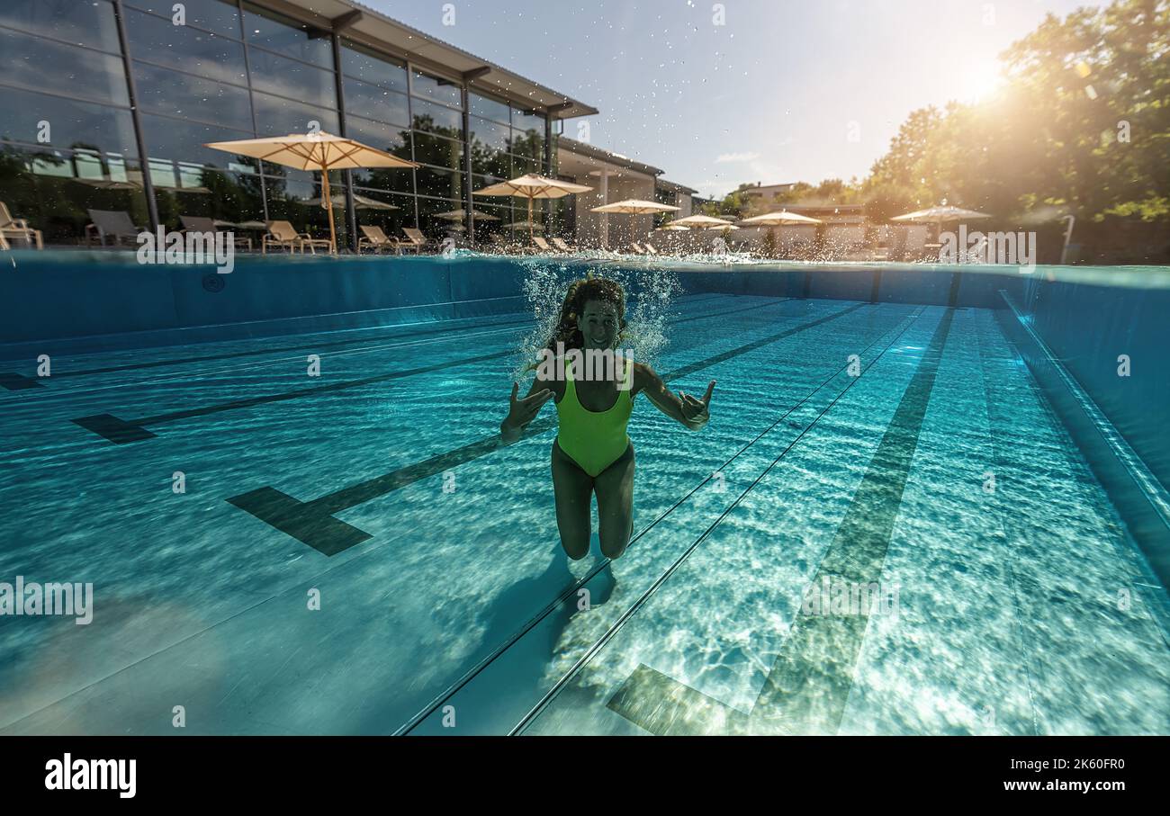 Woman parasol swimming pool hi-res stock photography and images - Alamy