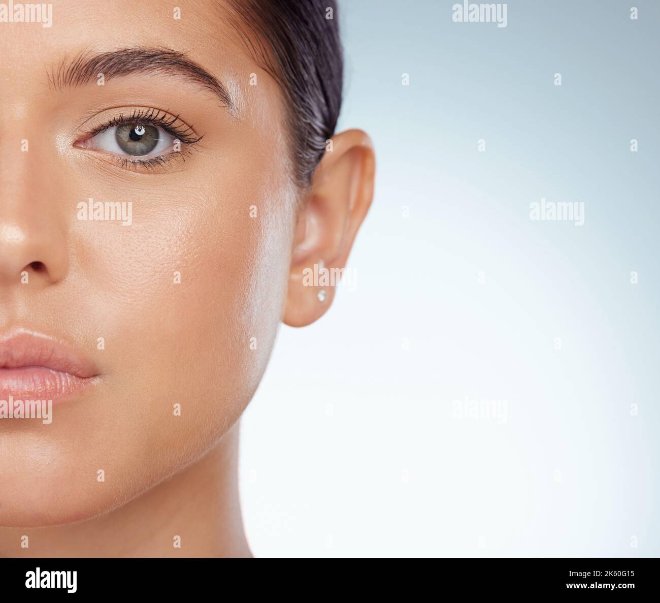 Closeup half face portrait of beautiful woman with smooth glowing skin ...