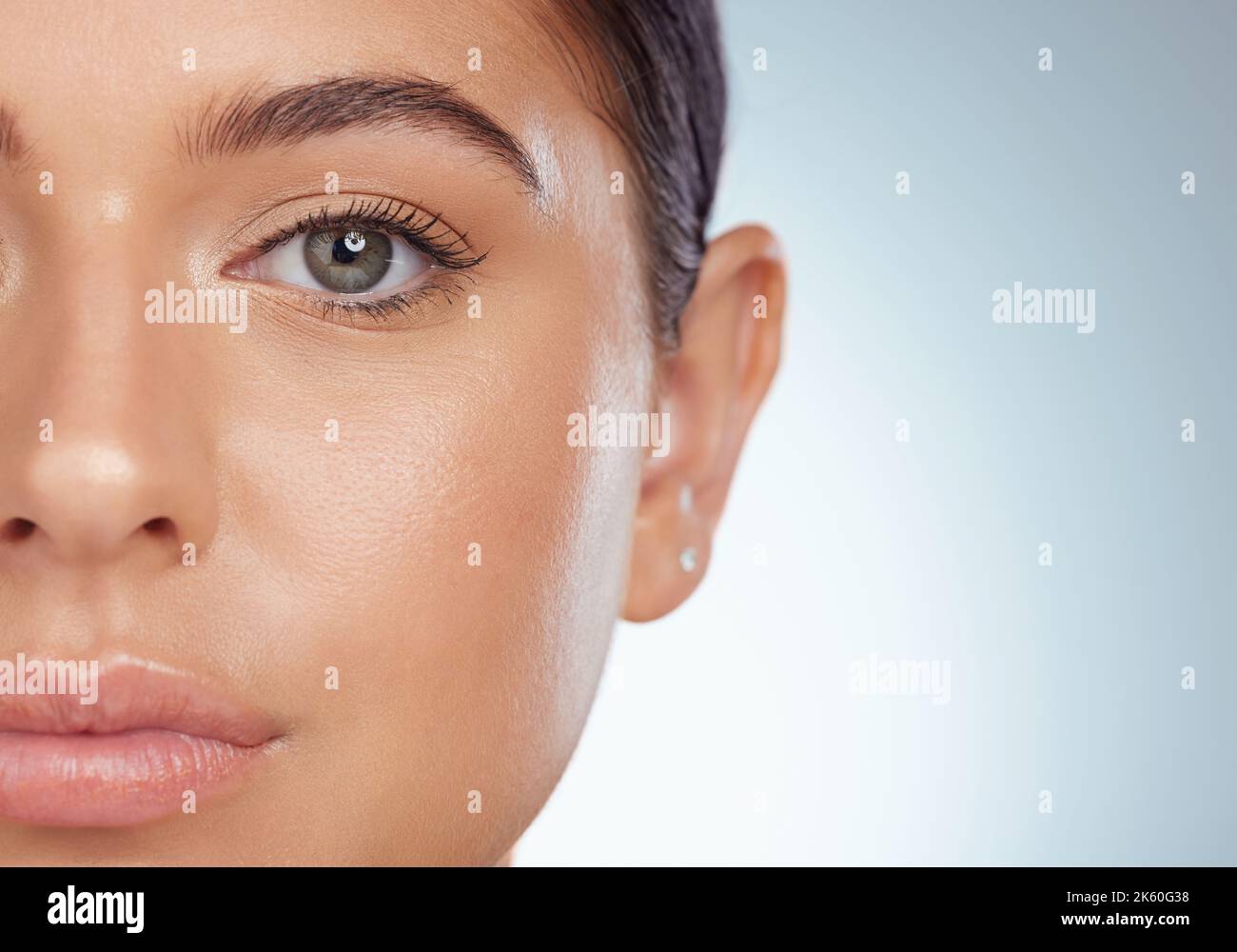 Closeup half face portrait of beautiful woman with smooth glowing skin ...