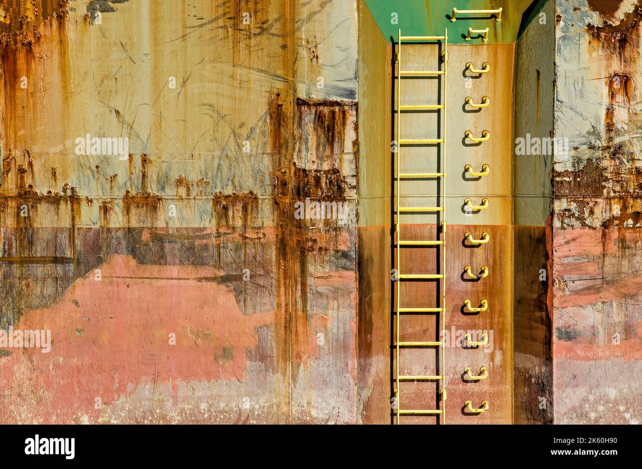 Colorfull section of an old ship's hull with rust, scratches, peeling ...