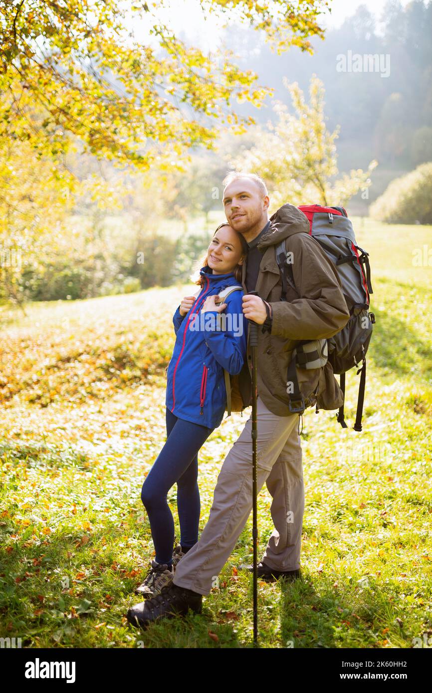 Portrait of a young couple in love traveling together in the mountains ...