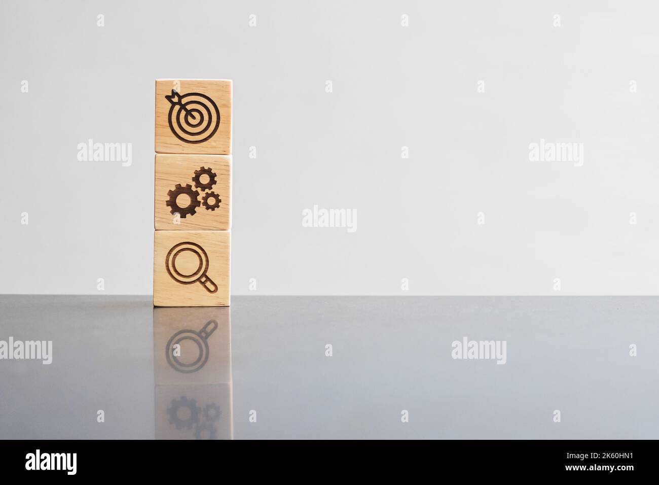 wood block with business goal, strategy, target, mission, action ...