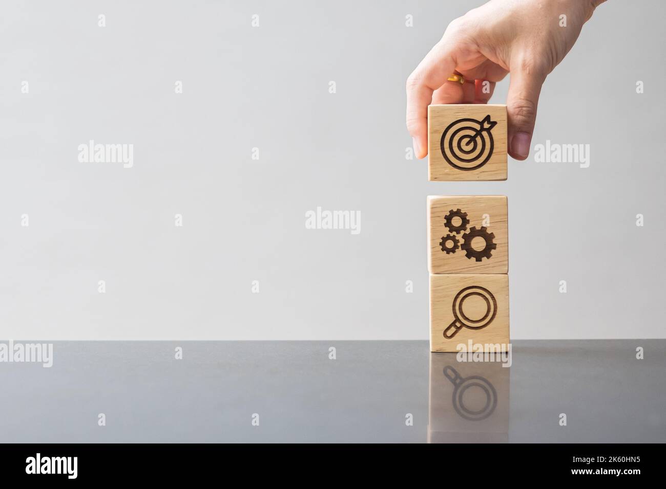 wood block with business goal, strategy, target, mission, action ...