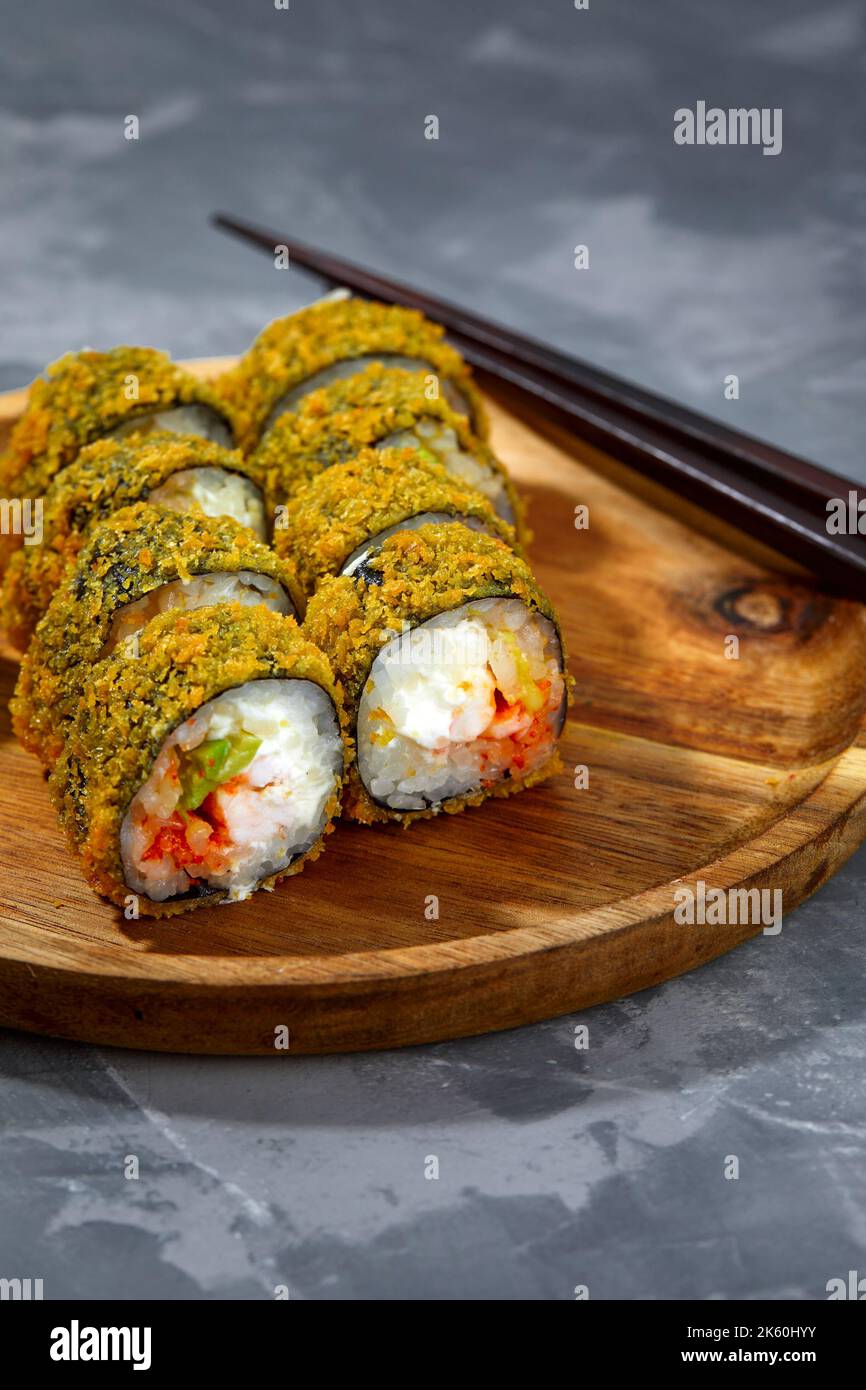 Tempura Maki Sushi Deep Fried Sushi Roll Served on wooden board Stock ...