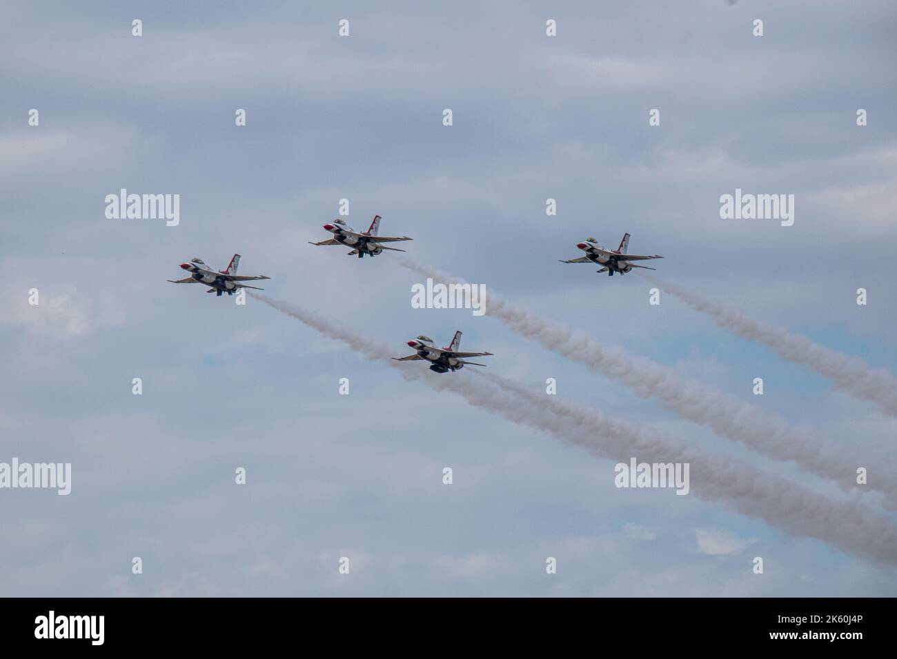 A low angle shot of fighter jets flying in formation for an air show ...