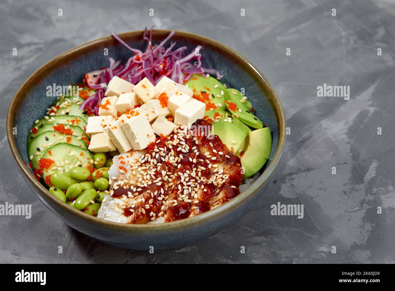 Top view on poke salad with eel and green vegetable in the bowls on ...