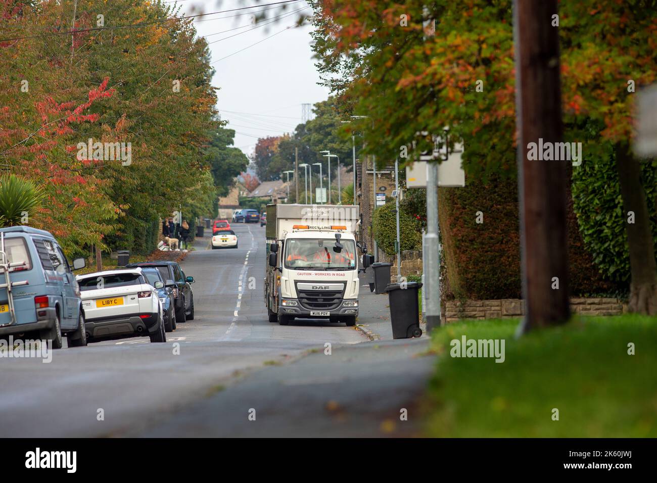 Suez waste recycling operatives collect recycled waste around the ...