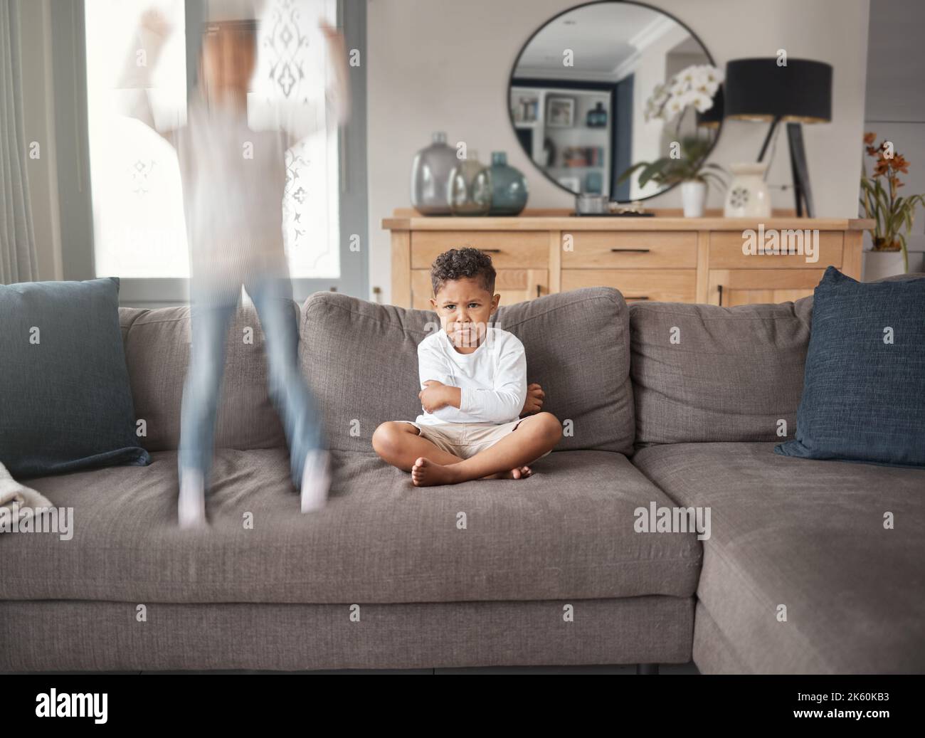 Two young mixed race siblings showing their different personalities ...