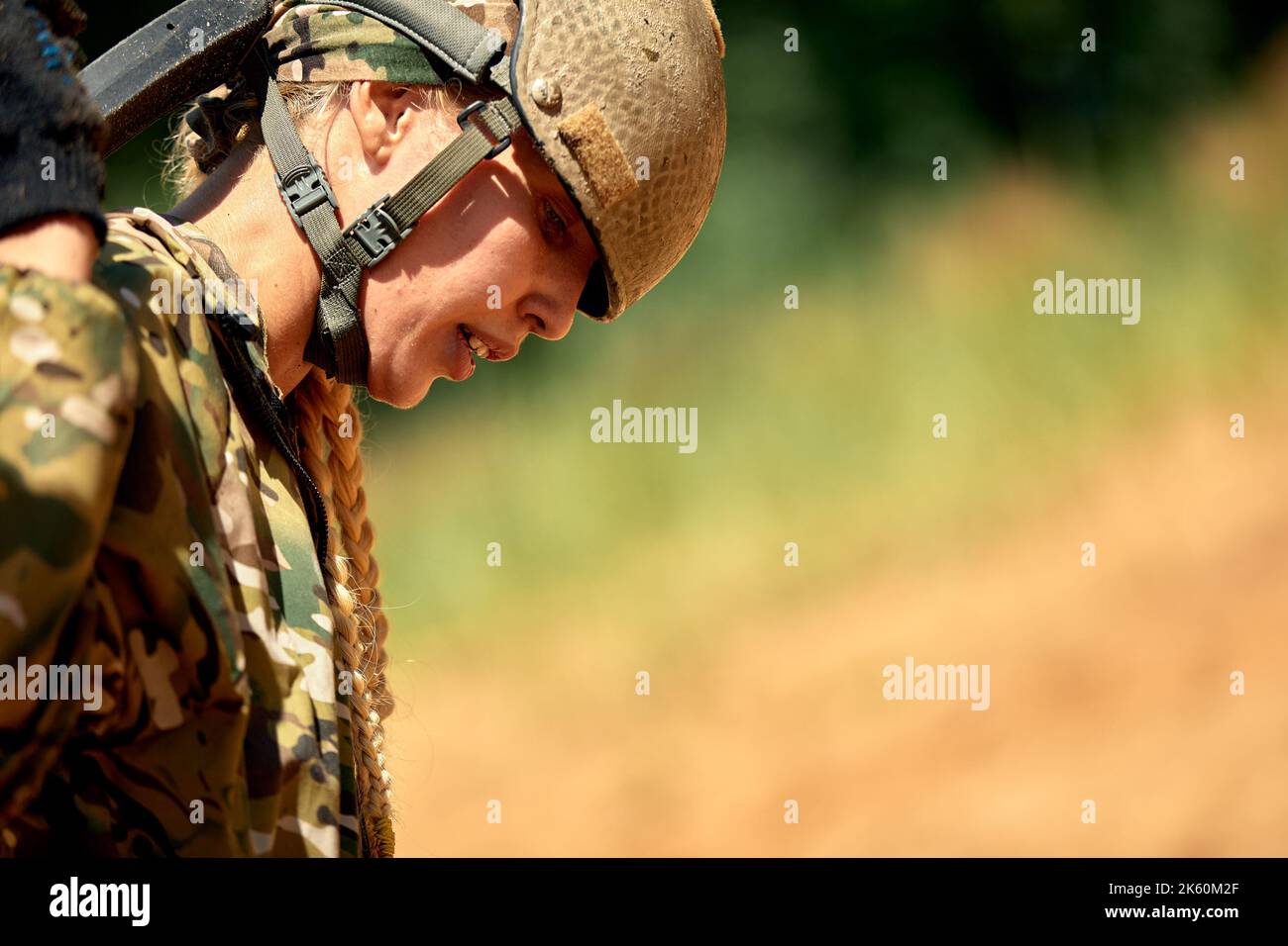 Caucasian Military lady woman in tactical gear posing for photo in ...