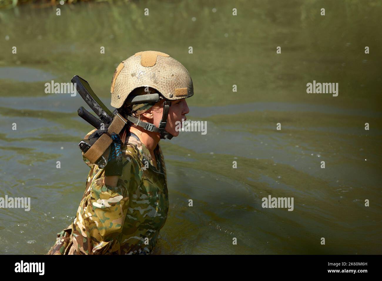 Caucasian Military lady woman in tactical gear posing for photo in ...