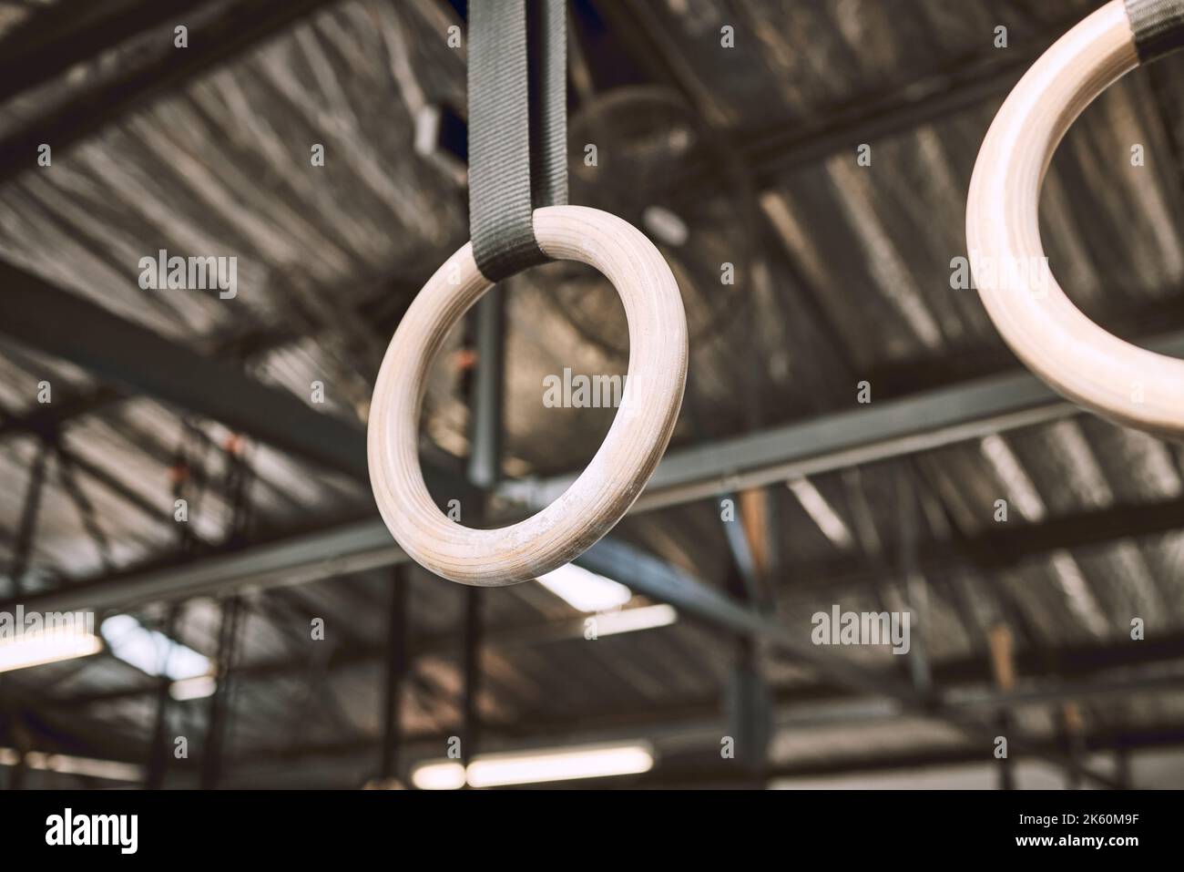 Hanging acrobat rings in emtpy gym. Gymnastic rings hanging in a gym ...