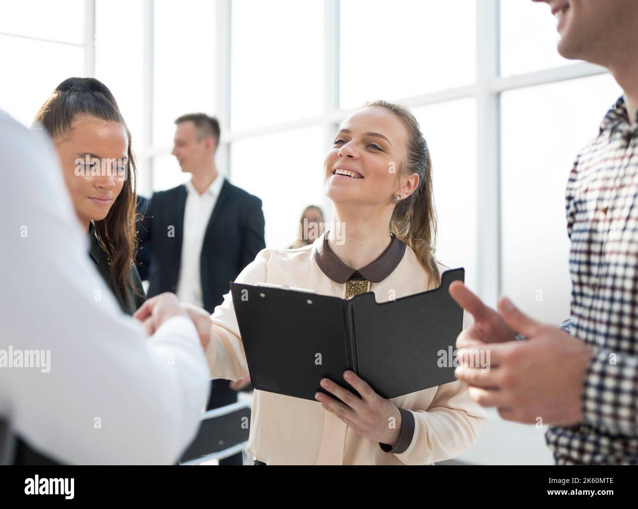 close up. young employees pointing at their colleague Stock Photo - Alamy