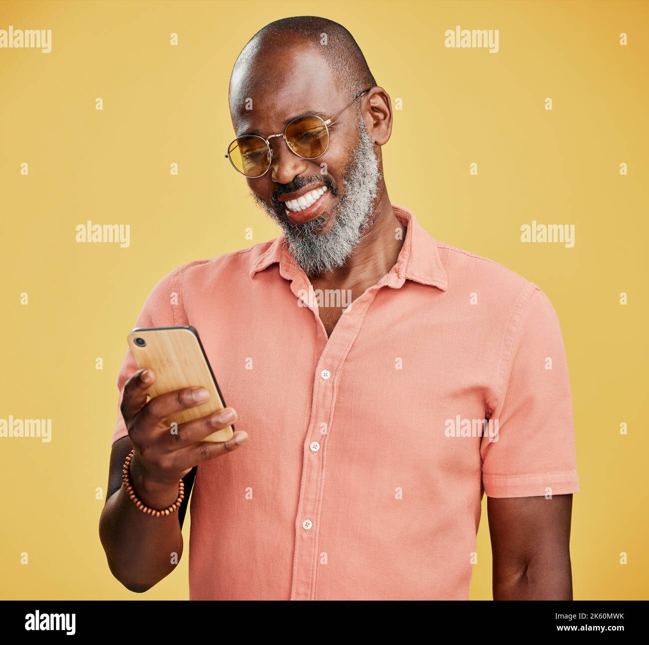 Positive bald african man typing hi-res stock photography and images ...