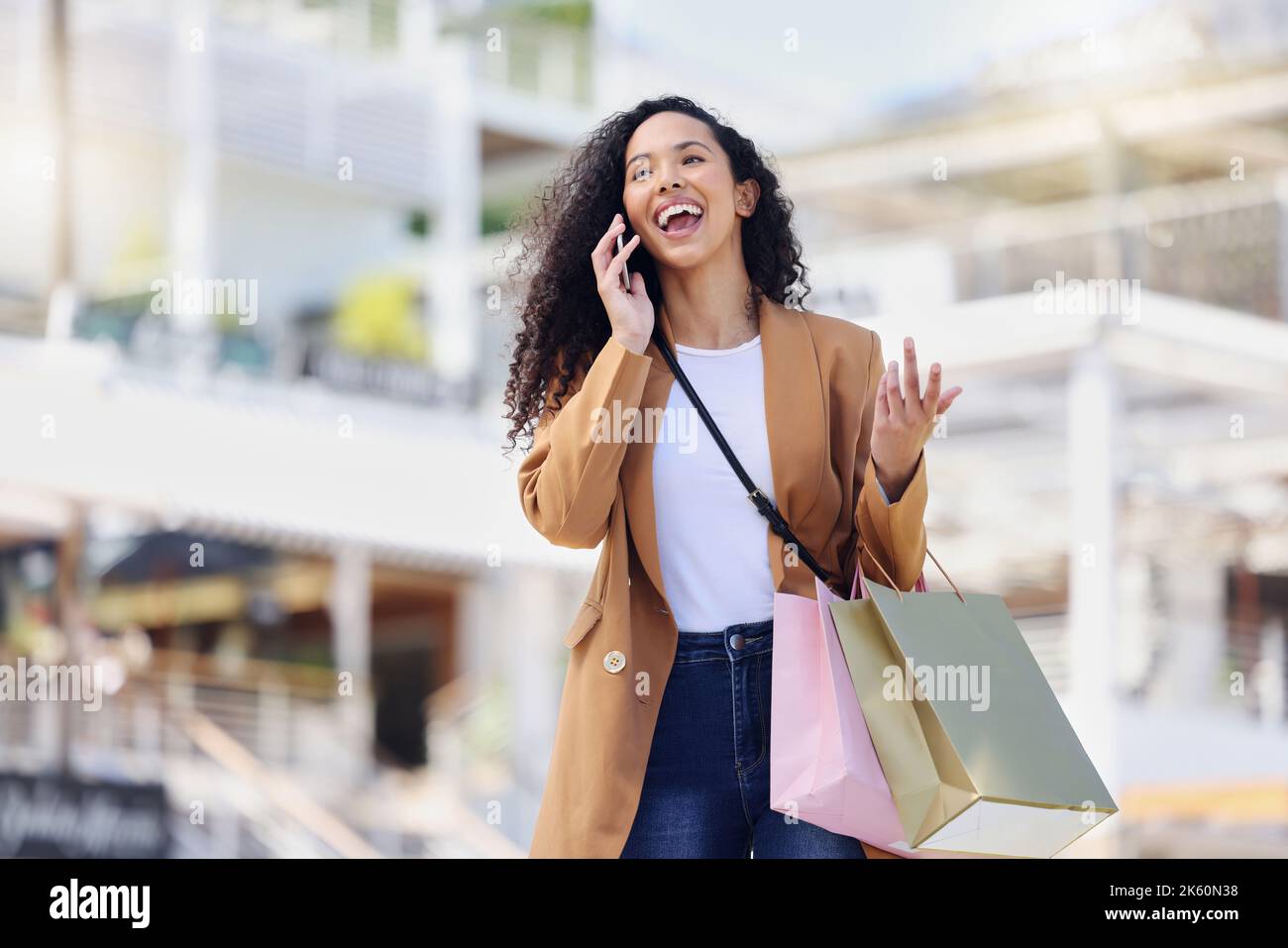 Happy woman, shopping and phone call in the mall in communication about ...