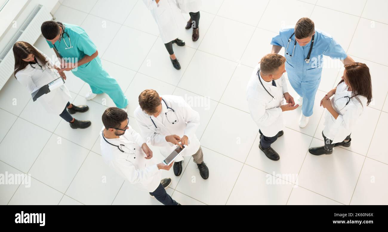 top view. team of medical professionals discussing issues together ...