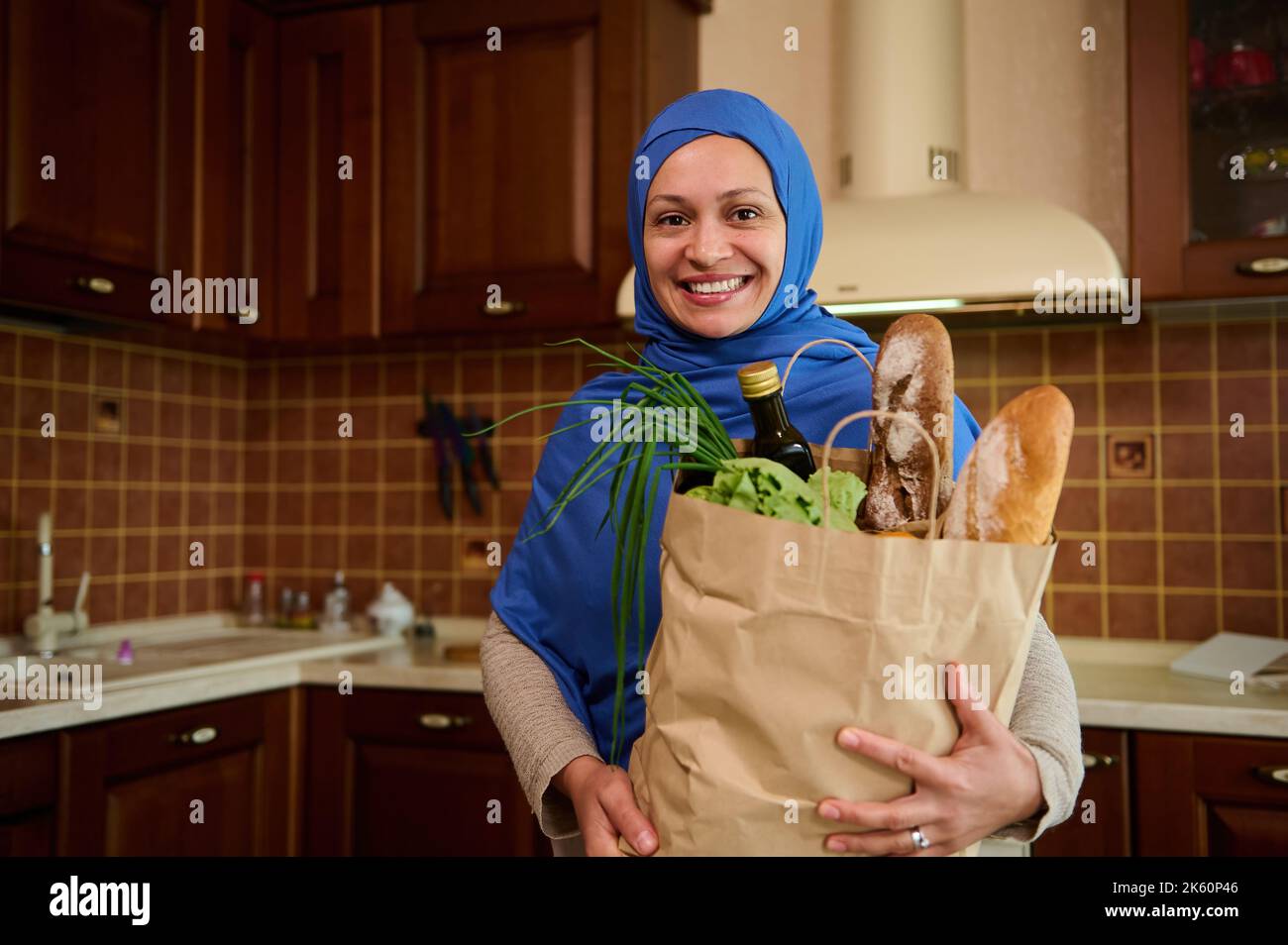 Arab Muslim housewife in hijab, smiling a beautiful toothy smile ...