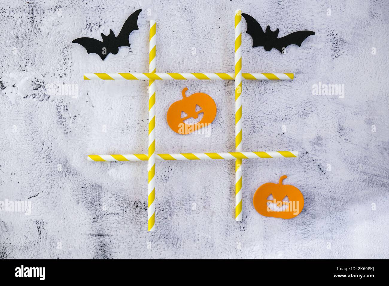 Creative tic tac toe game made of halloween decorations. Ghost bat ...
