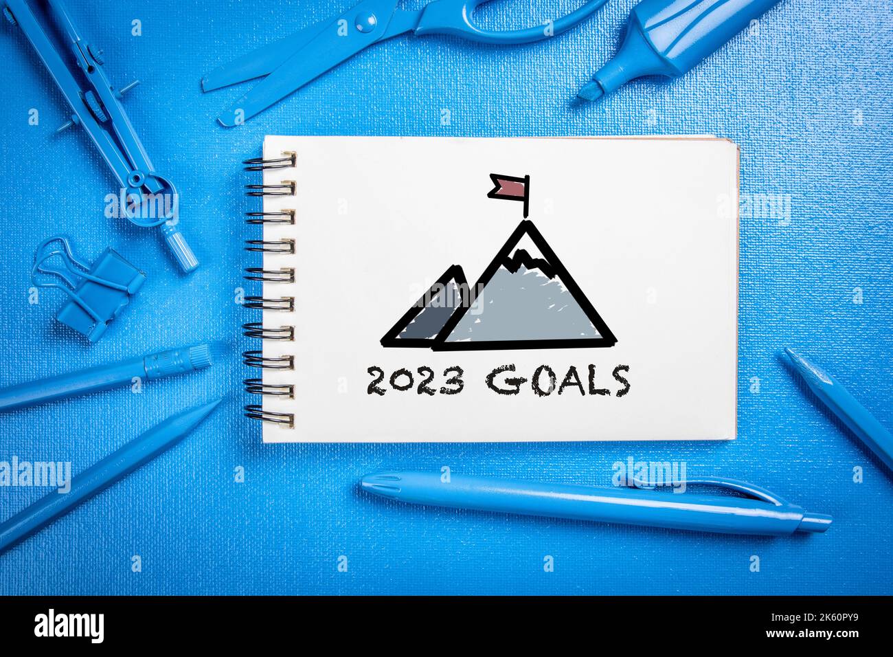 2023 goals concept. Abstract blue office desk. Stationery Stock Photo ... 2023 goals concept. Abstract blue office desk. Stationery Stock Photo ...