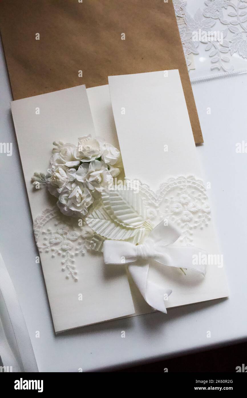 Homemade greeting card in white. With decorative elements. Ribbons ...
