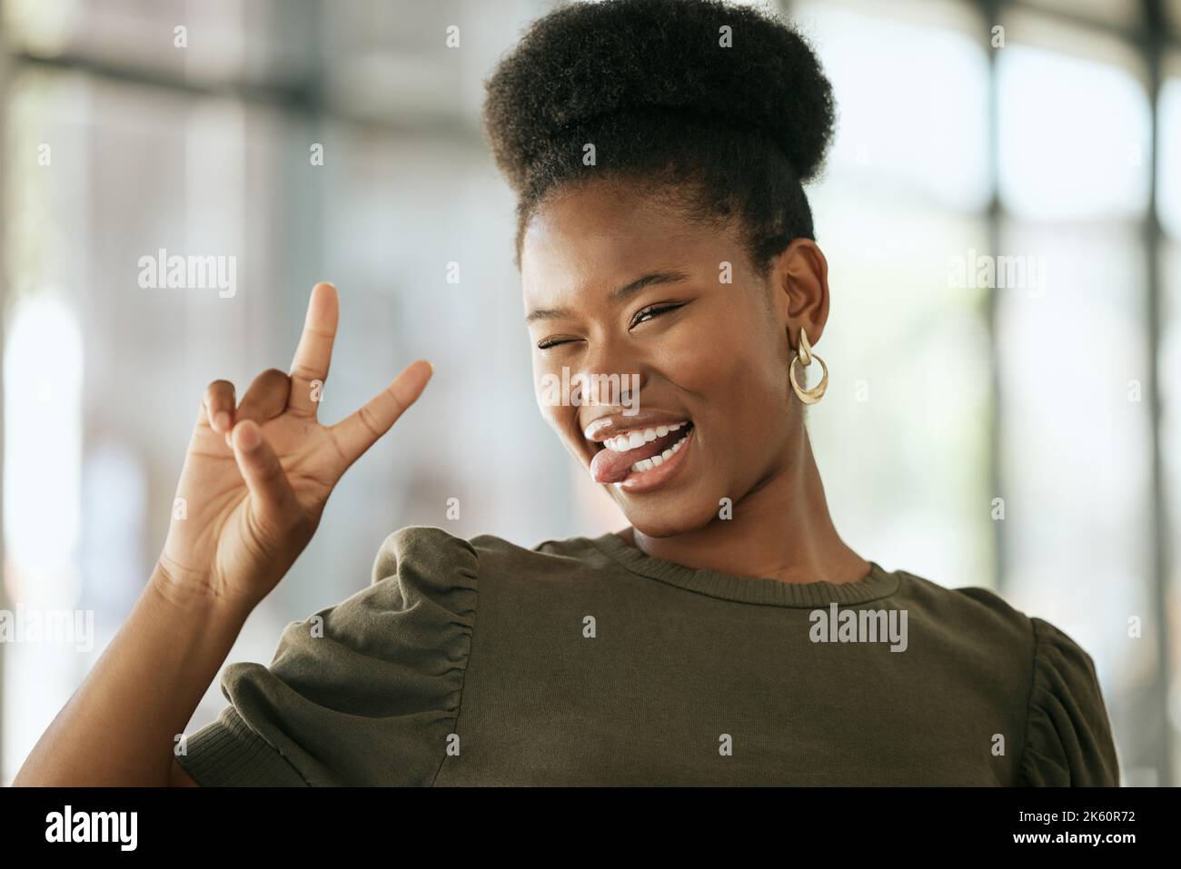 Happy excited african american professional showing peace sign and ...
