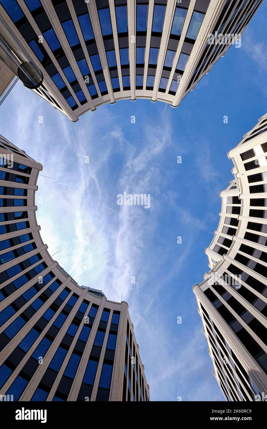 A low angle shot of urban circular round buildings with windows under ...