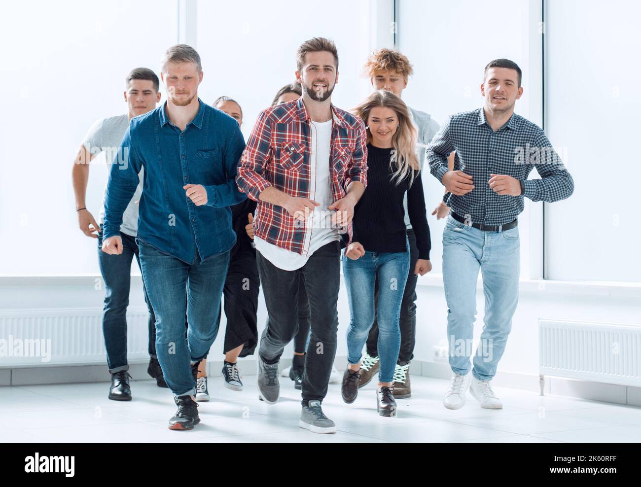 group of diverse young people running forward Stock Photo - Alamy