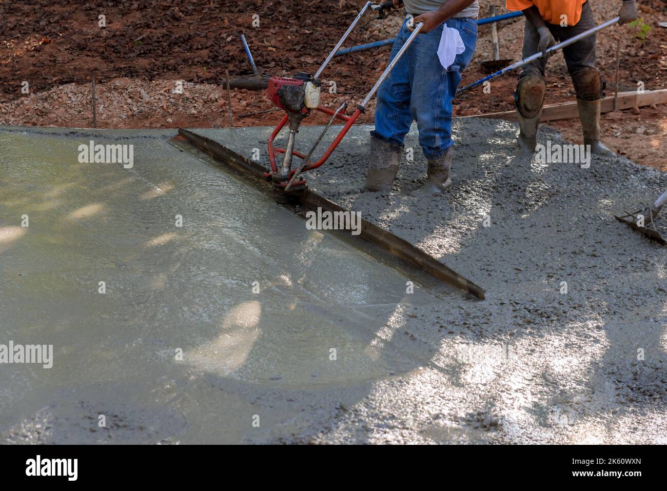 Machine to align fresh concrete compacted layer fresh concrete on new ...