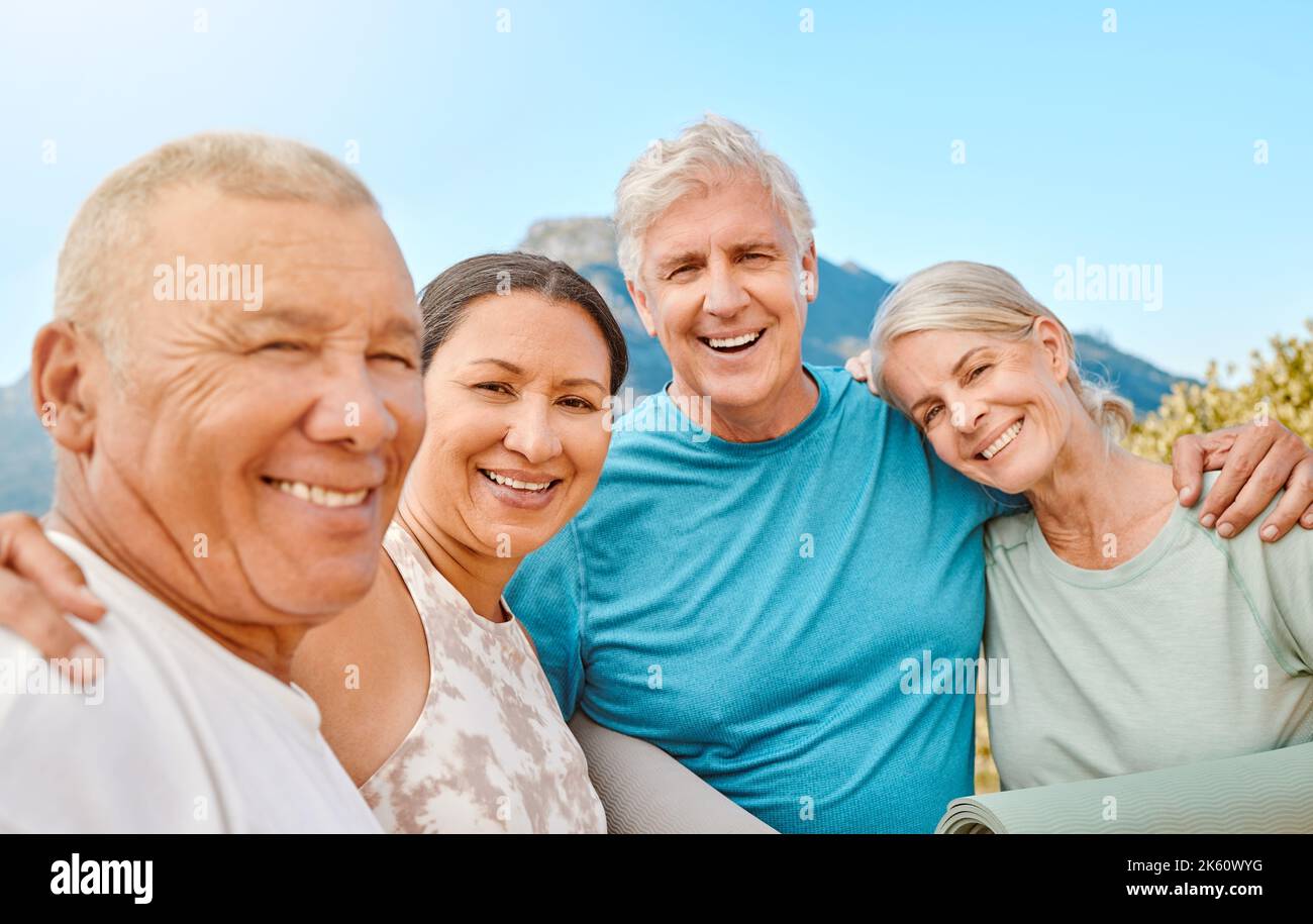 Portrait of a group of senior friends standing together. Smiling active ...