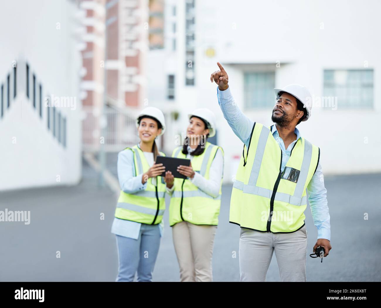 Construction, planning and architects talking about a building project ...