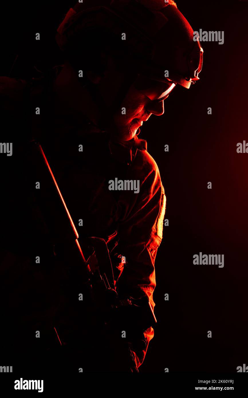 Studio contour backlight shot of special forces soldier in uniforms ...