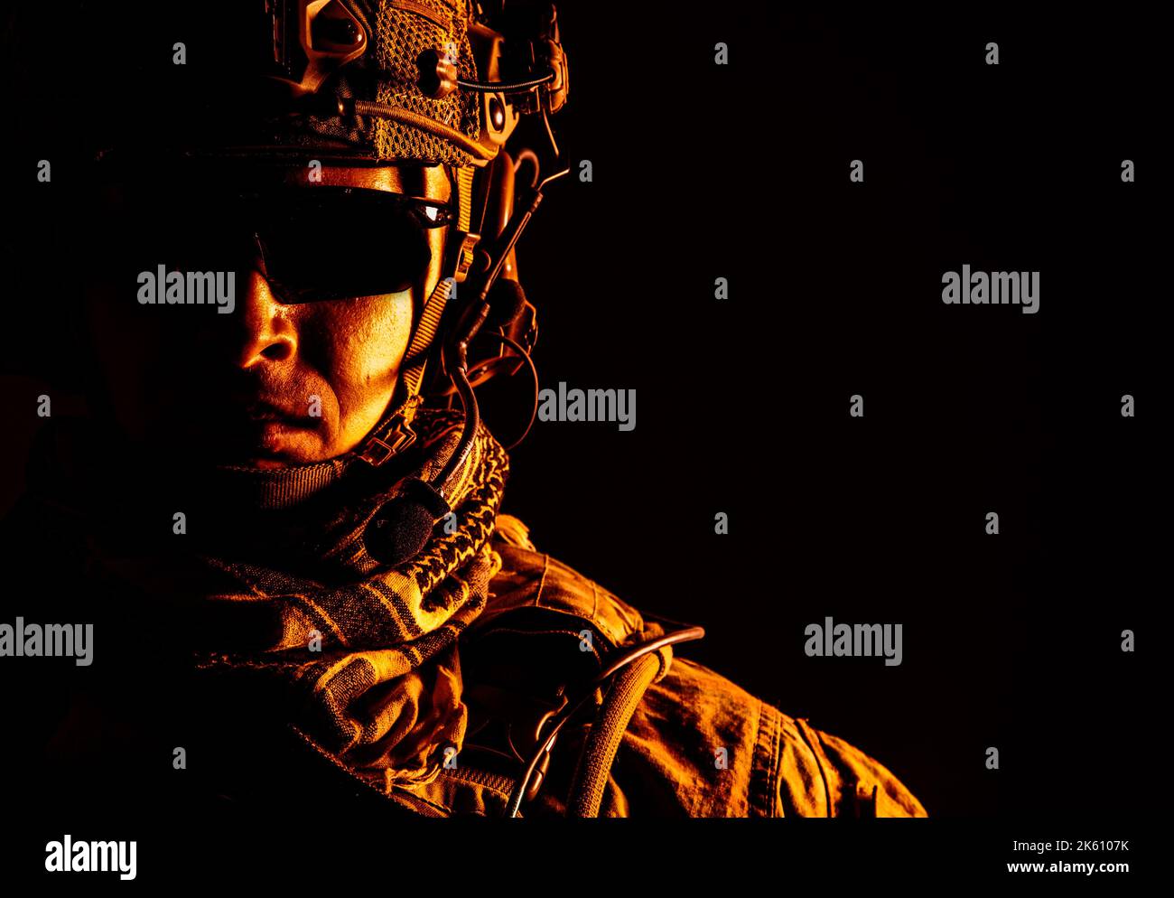 Elite member of US Army ranger in combat helmet and dark glasses ...