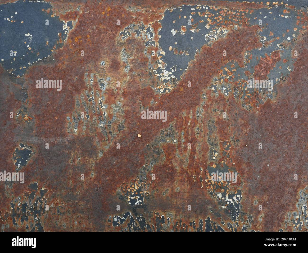 Brown rust stain on the black with blue with green with gray and silver ...