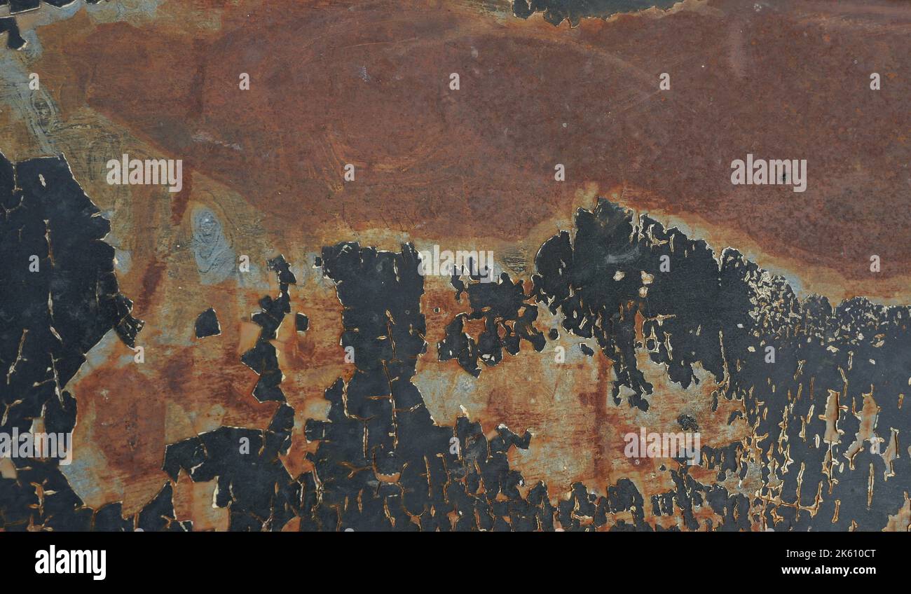 Brown rust stain on the black with blue with green with gray and silver ...