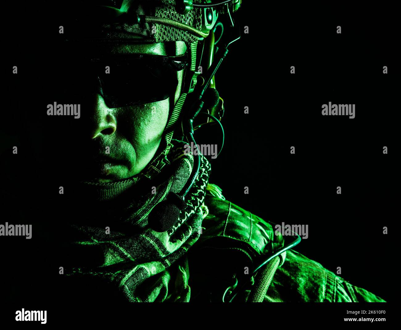 Elite member of US Army ranger in combat helmet and dark glasses ...