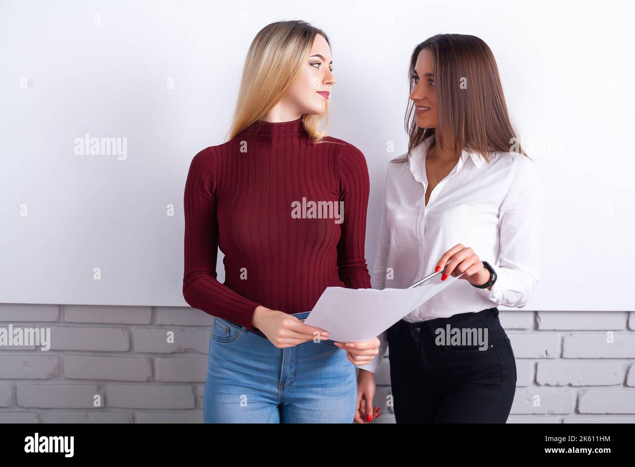 Two female colleagues in office working together Stock Photo - Alamy