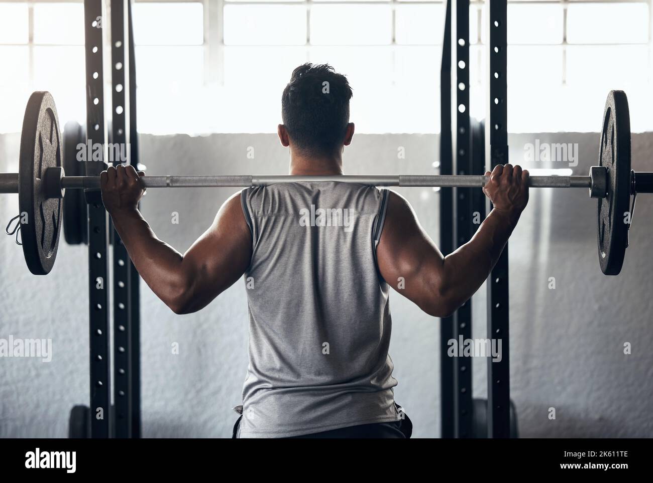 Fitness exercise in gym, man weightlifting barbell and athlete training ...