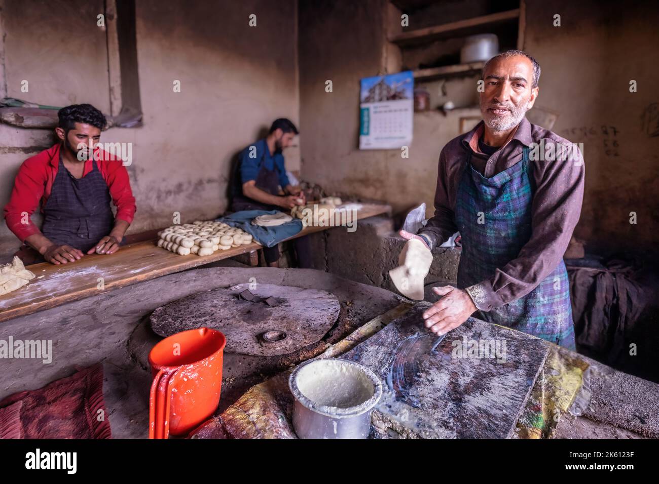 Men preparing dough and bread in a bakery in Leh, Ladakh, India Stock ...