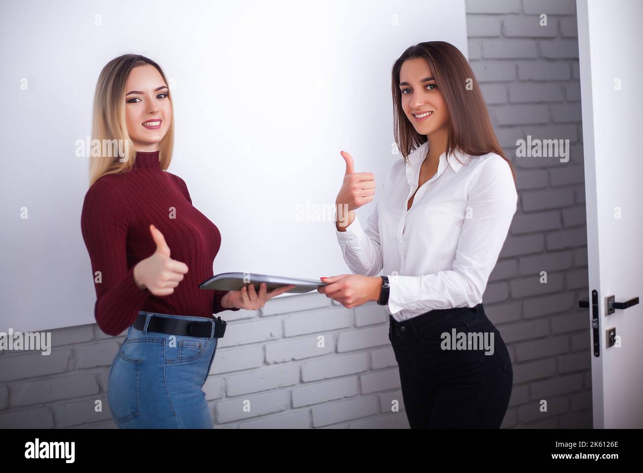 Two female colleagues in office working together Stock Photo - Alamy