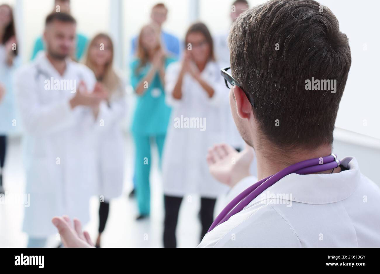 side view. group of happy young people standing together Stock Photo ...