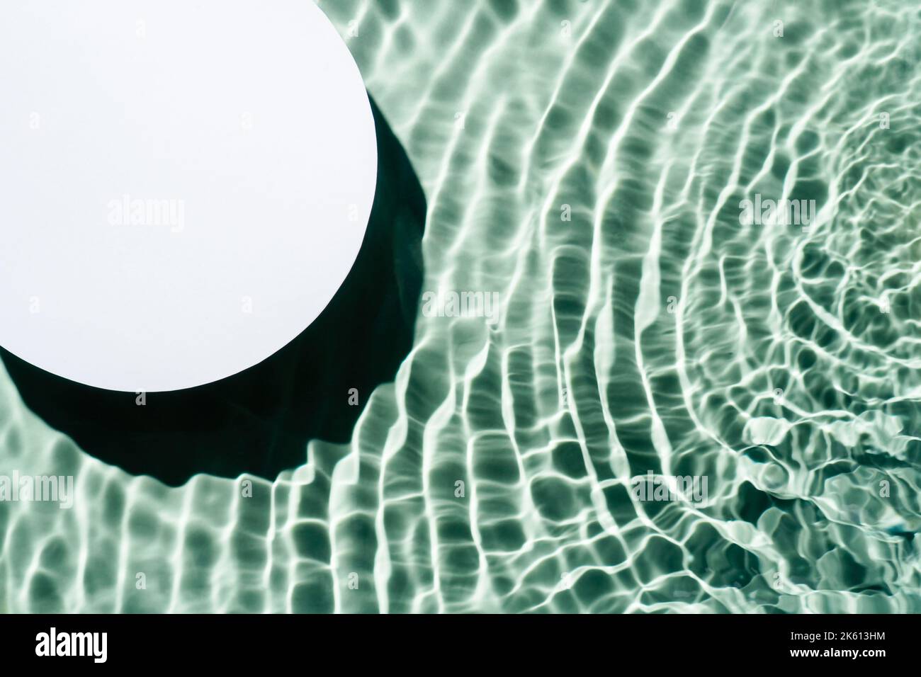 White circle copy space in transparent fresh green blue water drop ...