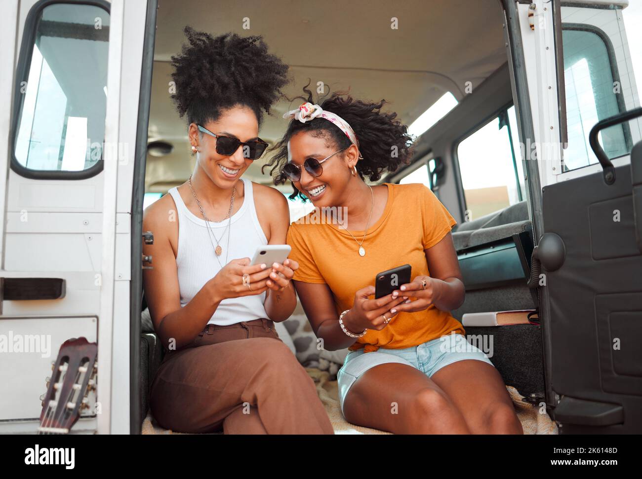 Women, road trip or phone for social media, gps location or map app for ...