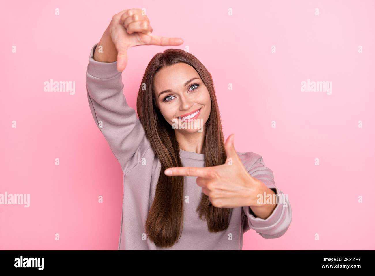 Photo of lovely cute satisfied lady arms demonstrate cadre gesture ...