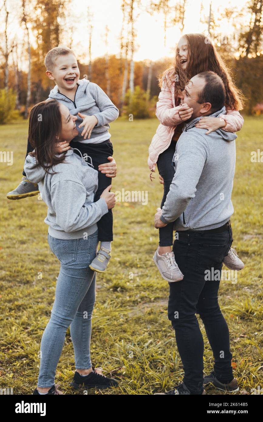 Portrait four happy family members hi-res stock photography and images ...