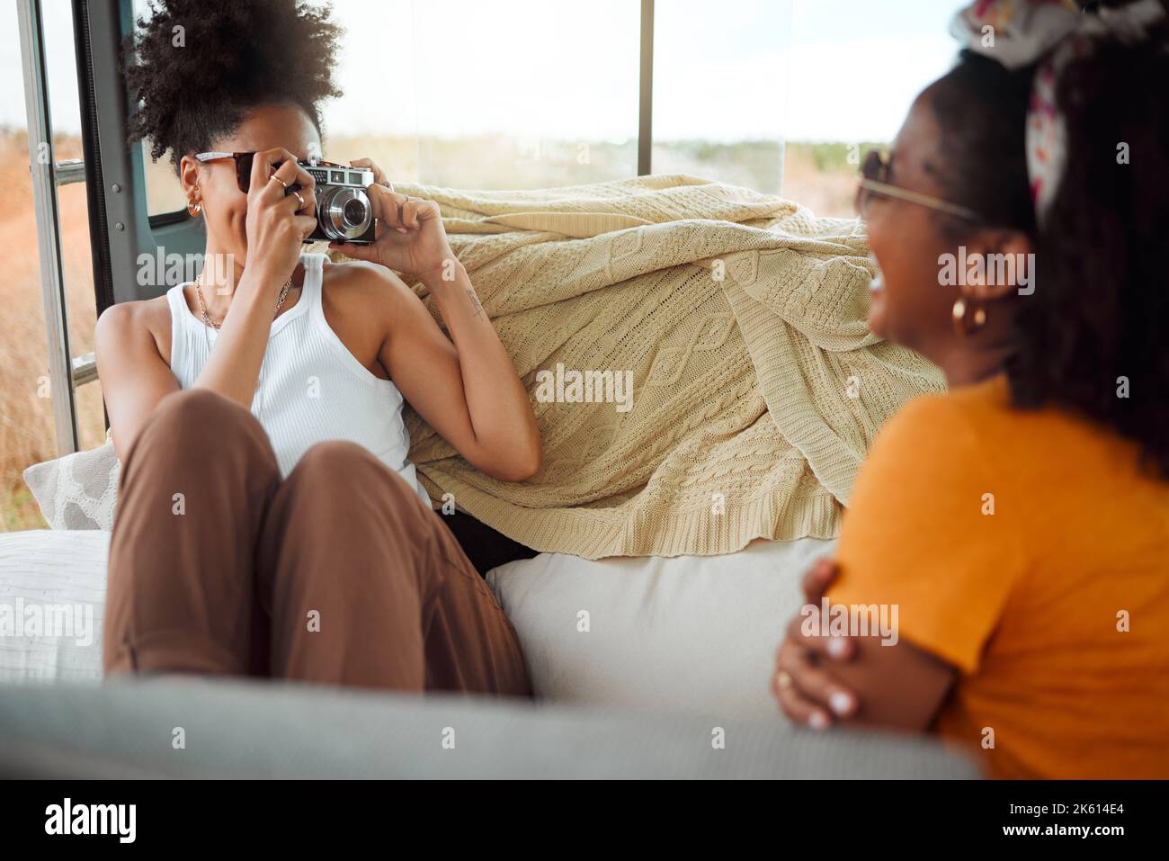 Girl friends, road trip and with camera in van for vacation pose in ...