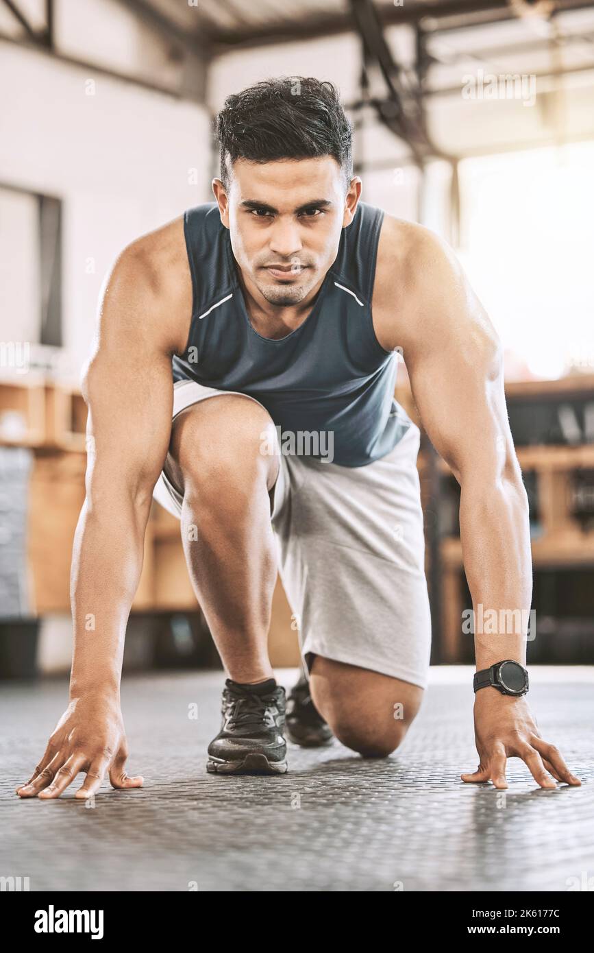 Portrait of fit athlete ready for a workout. Being strong takes ...