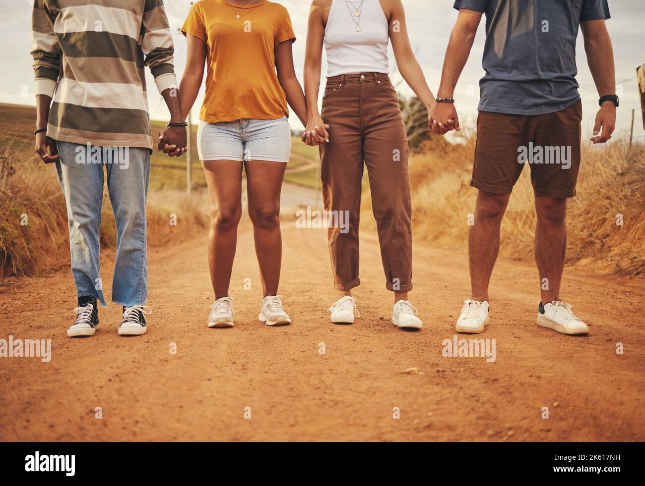 Friends hands together teamwork unity hi-res stock photography and ...