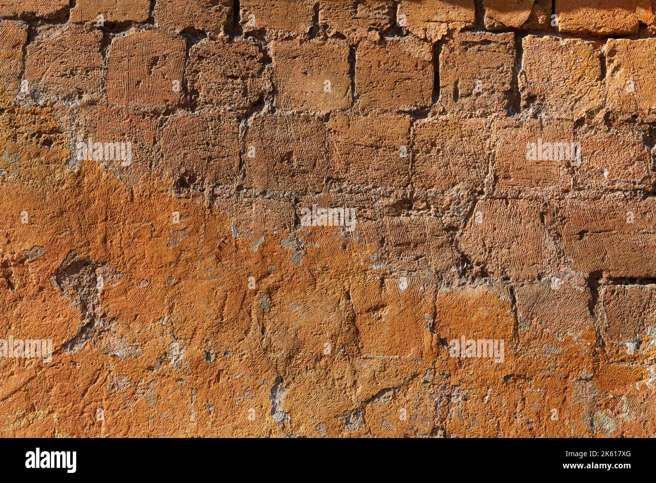 Texture of an old stone wall with rusty cracked plaster Stock Photo - Alamy