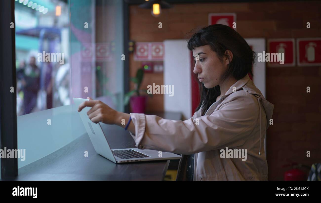 One hispanic young woman opening laptop browsing internet at remote ...