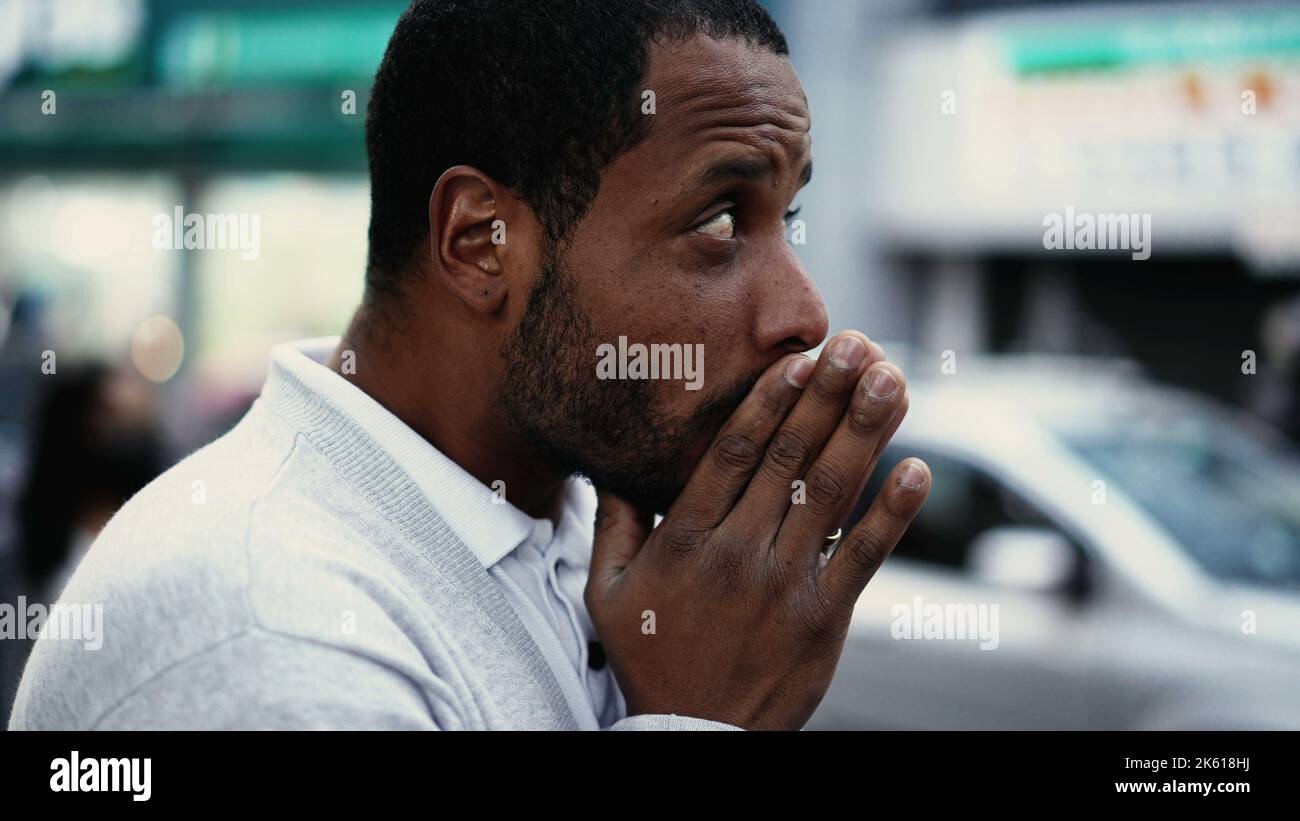 One spiritual young black man praying in street having HOPE and FAITH ...
